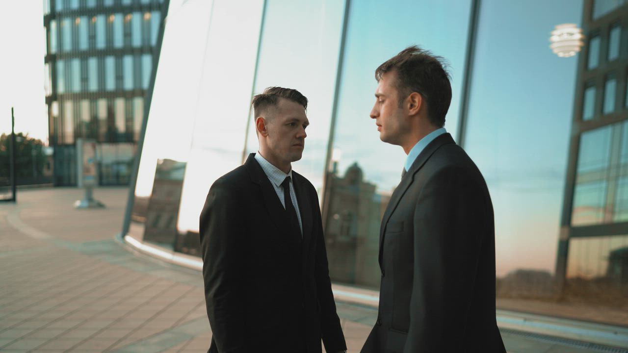 Two men in suits arguing - Free Stock Video