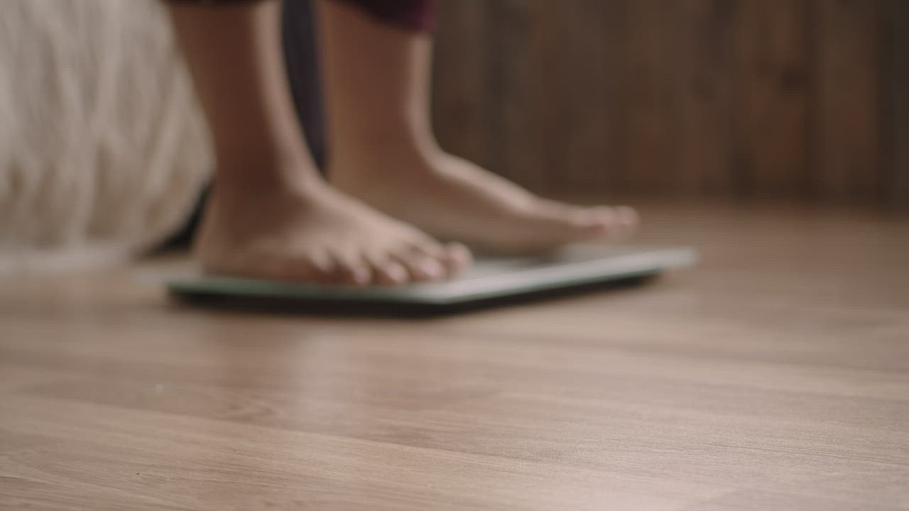 Close up of a tape measure falling to the floor - Free Stock Video