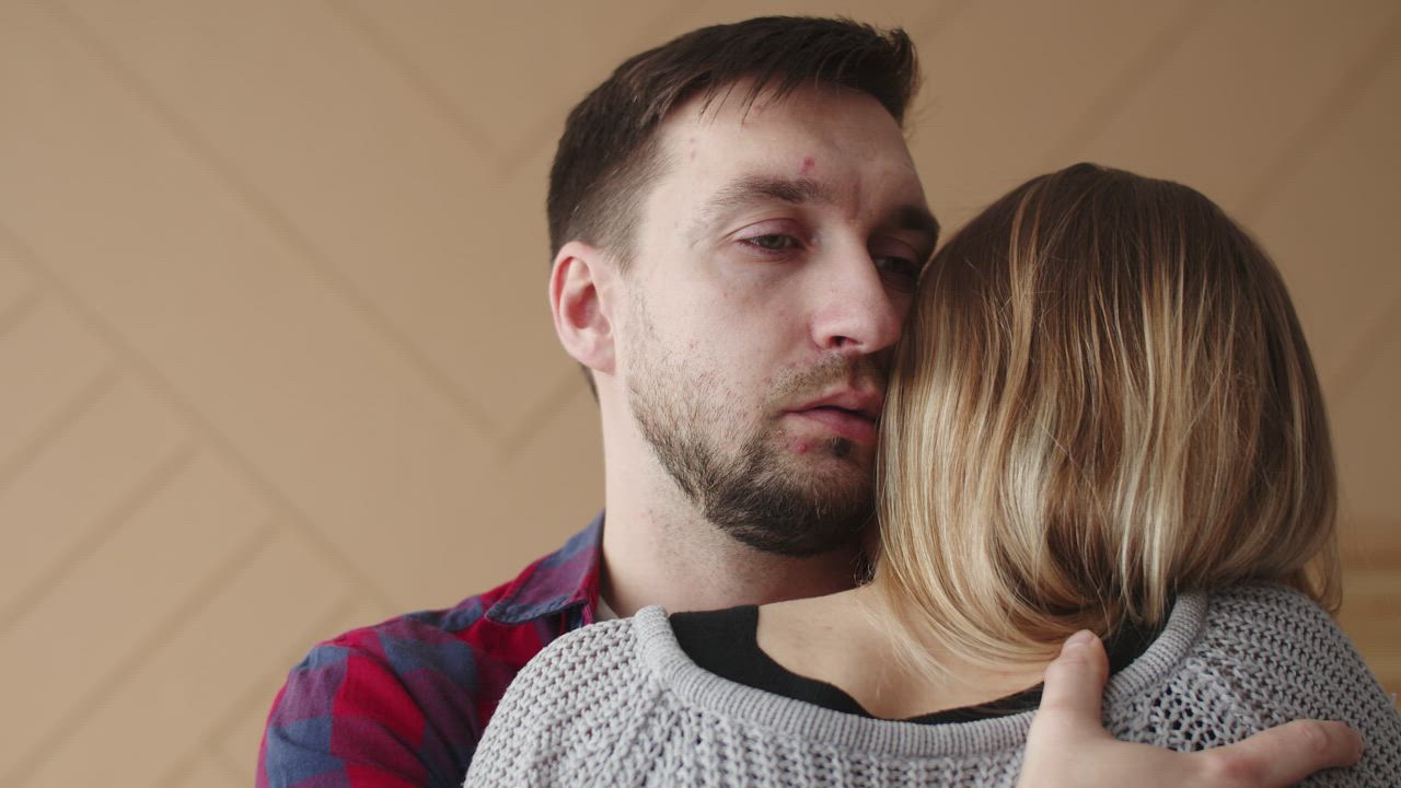 Couple sharing a hug of forgiveness after an arguement - Free Stock Video