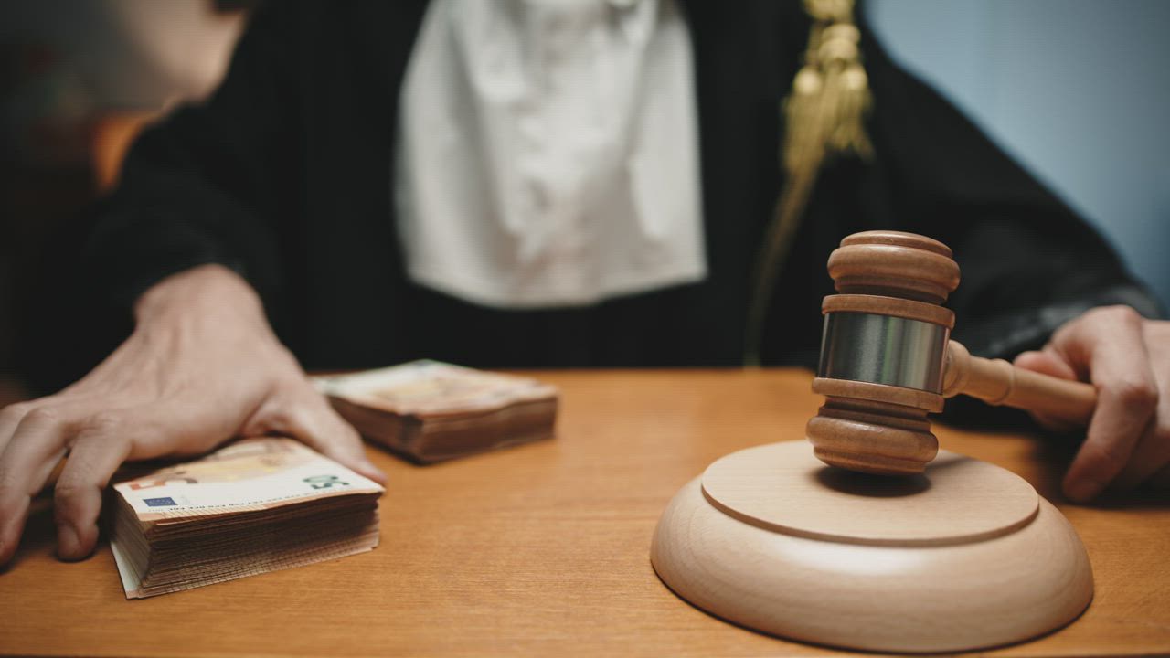 Judge Shows Money on Table - Free Stock Video