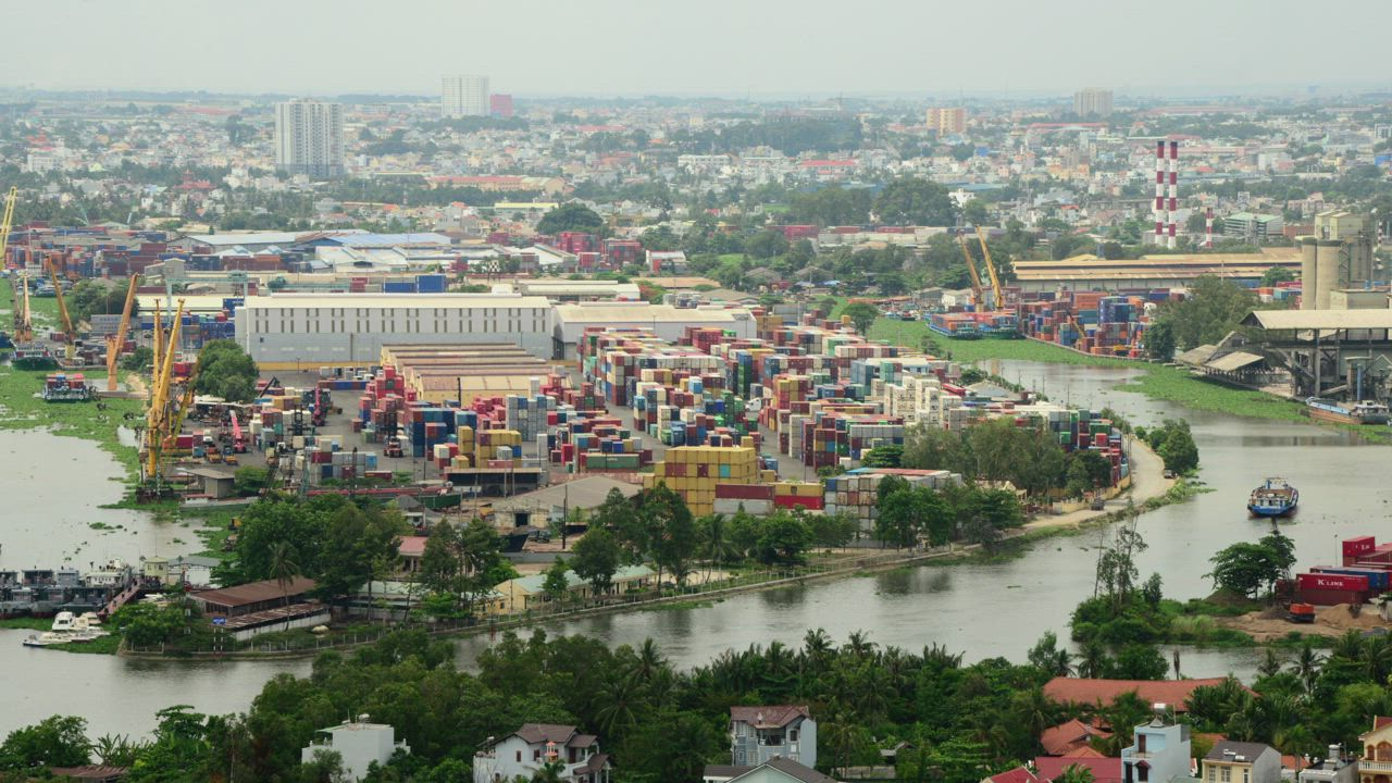 Shipping container port over a river - Free Stock Video