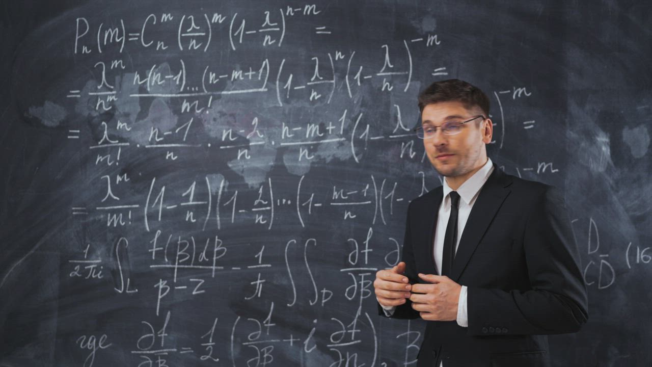 Teacher explaining mathematical formulas - Free Stock Video
