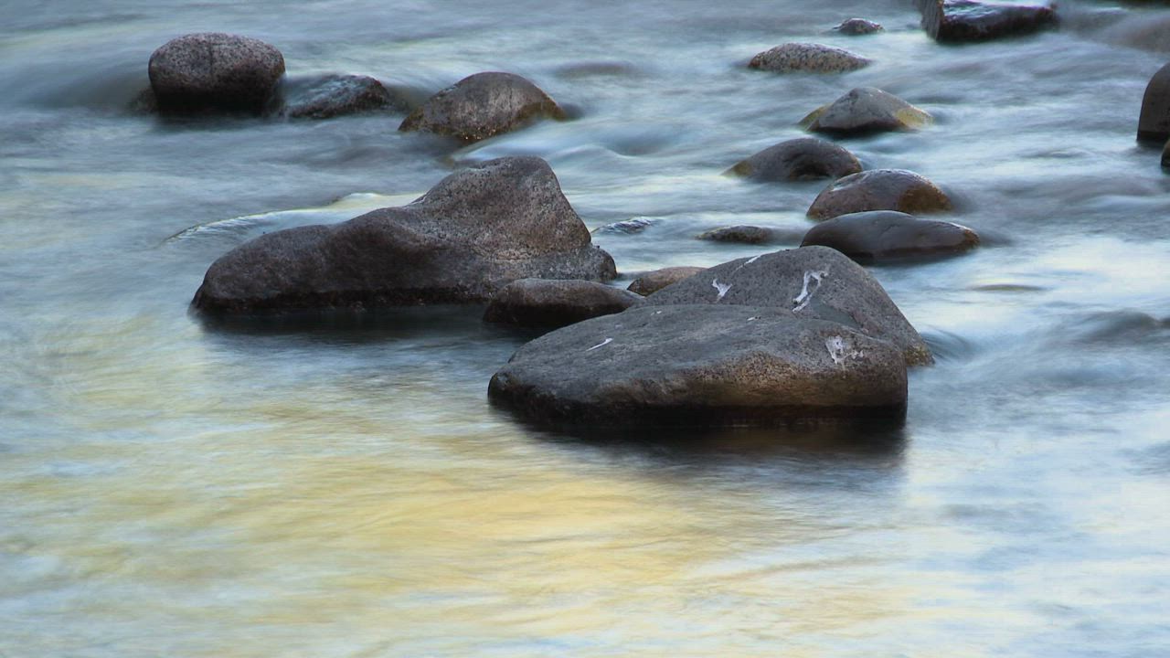 Close up of a rocks in a river - Free Stock Video