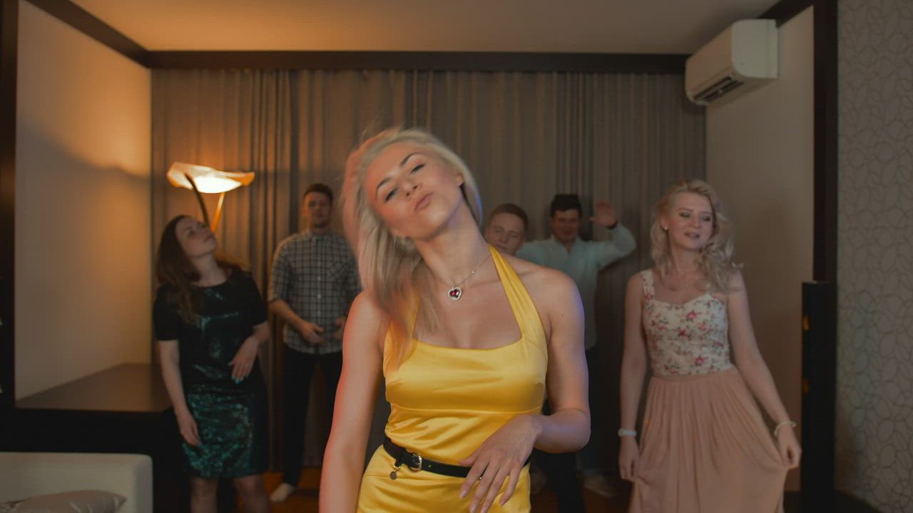 Woman dancing with her friends at a home party - Free Stock Video