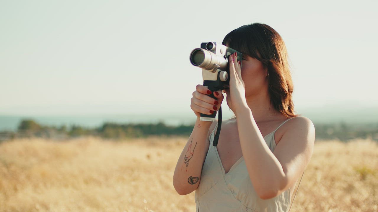 Filming a panning shot with a vintage 8mm camera on a farm - Free Stock ...