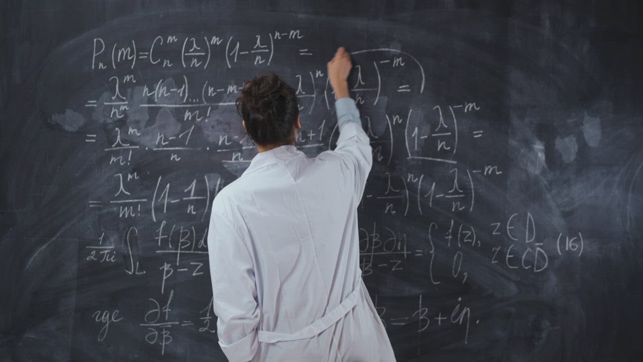 Scientist student solving formulas on a blackboard - Free Stock Video