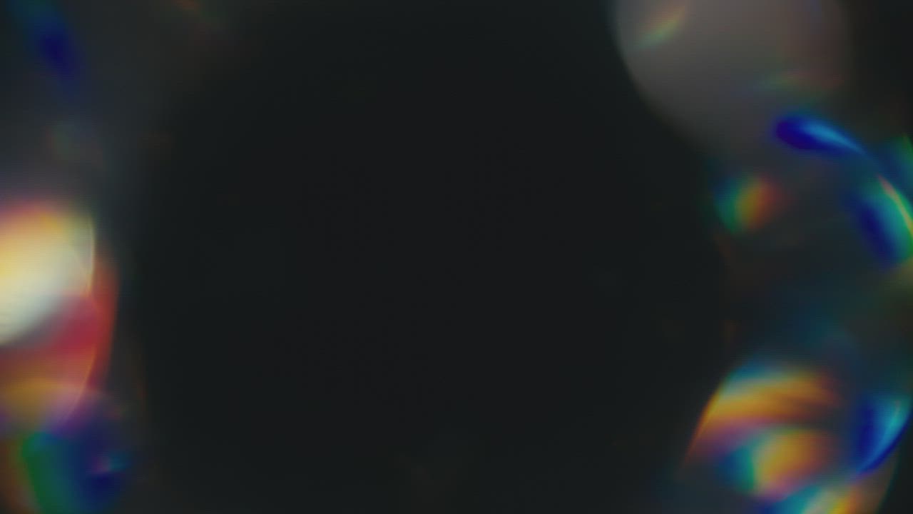 Black background with blurred light reflections - Free Stock Video