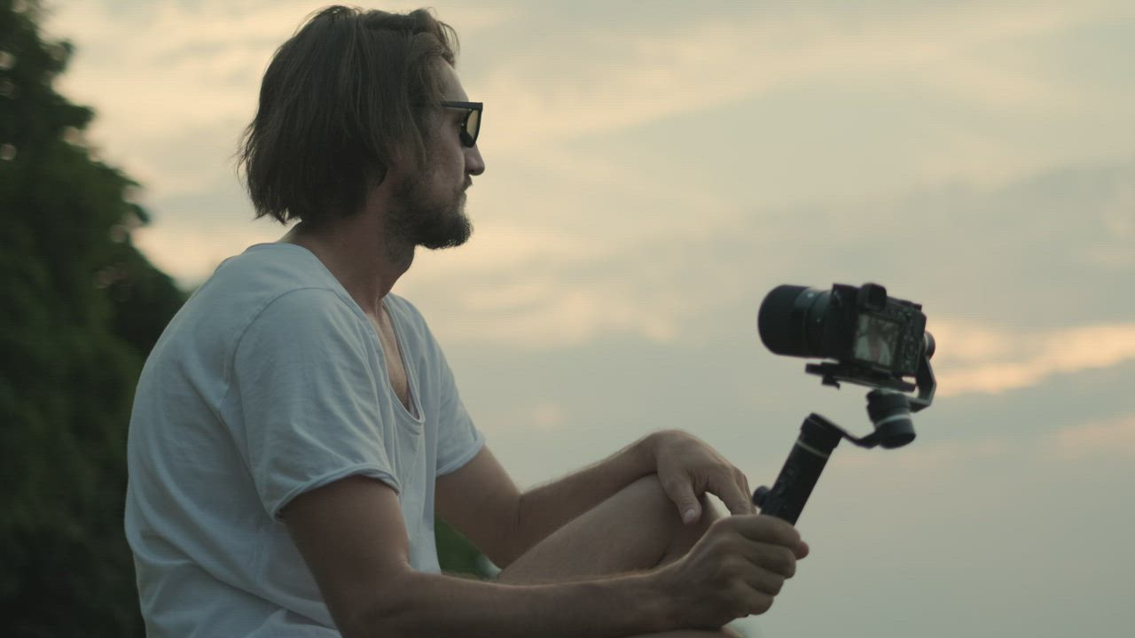 Vlogger man recording video outdoors - Free Stock Video