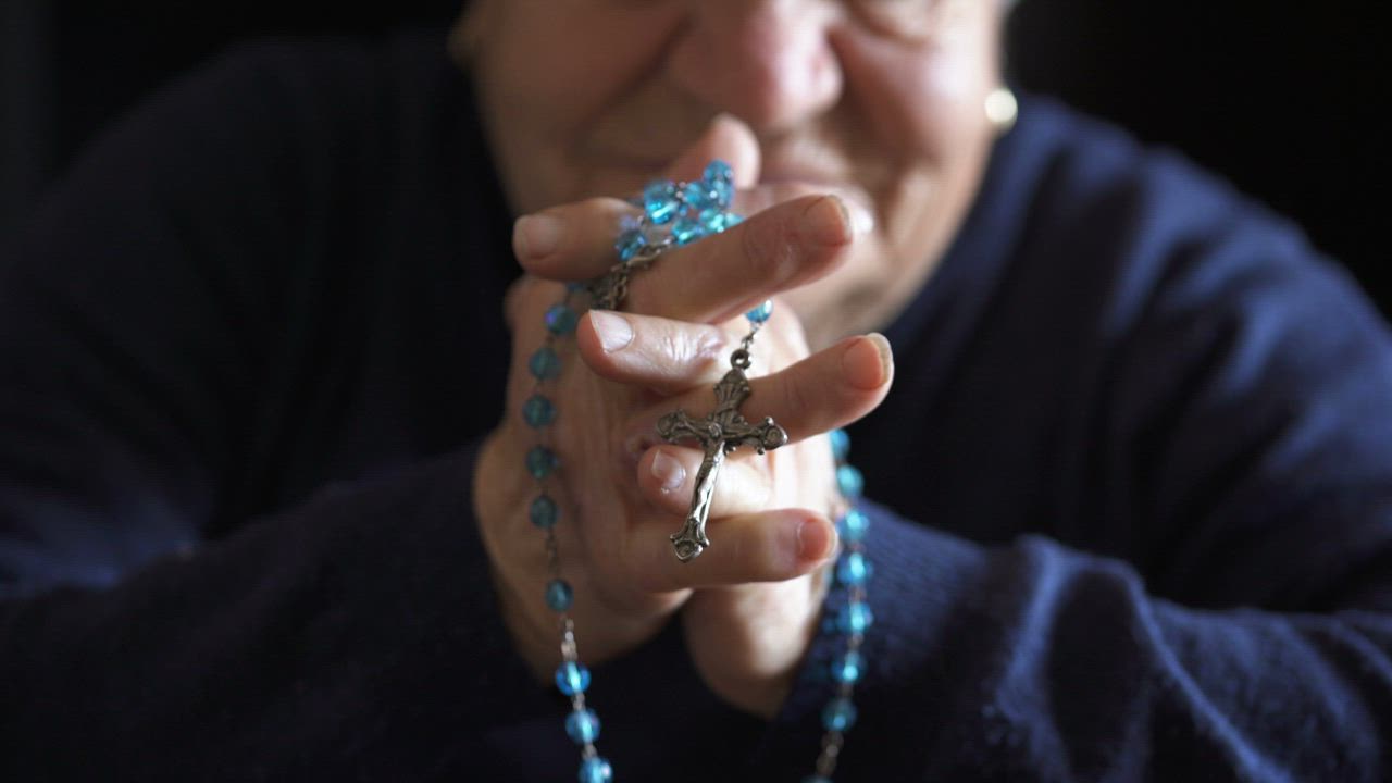Close up of prayer hands with rosary - Free Stock Video
