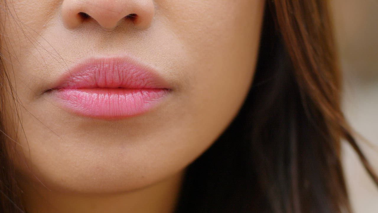 Close up of a woman's lips and nose - Free Stock Video