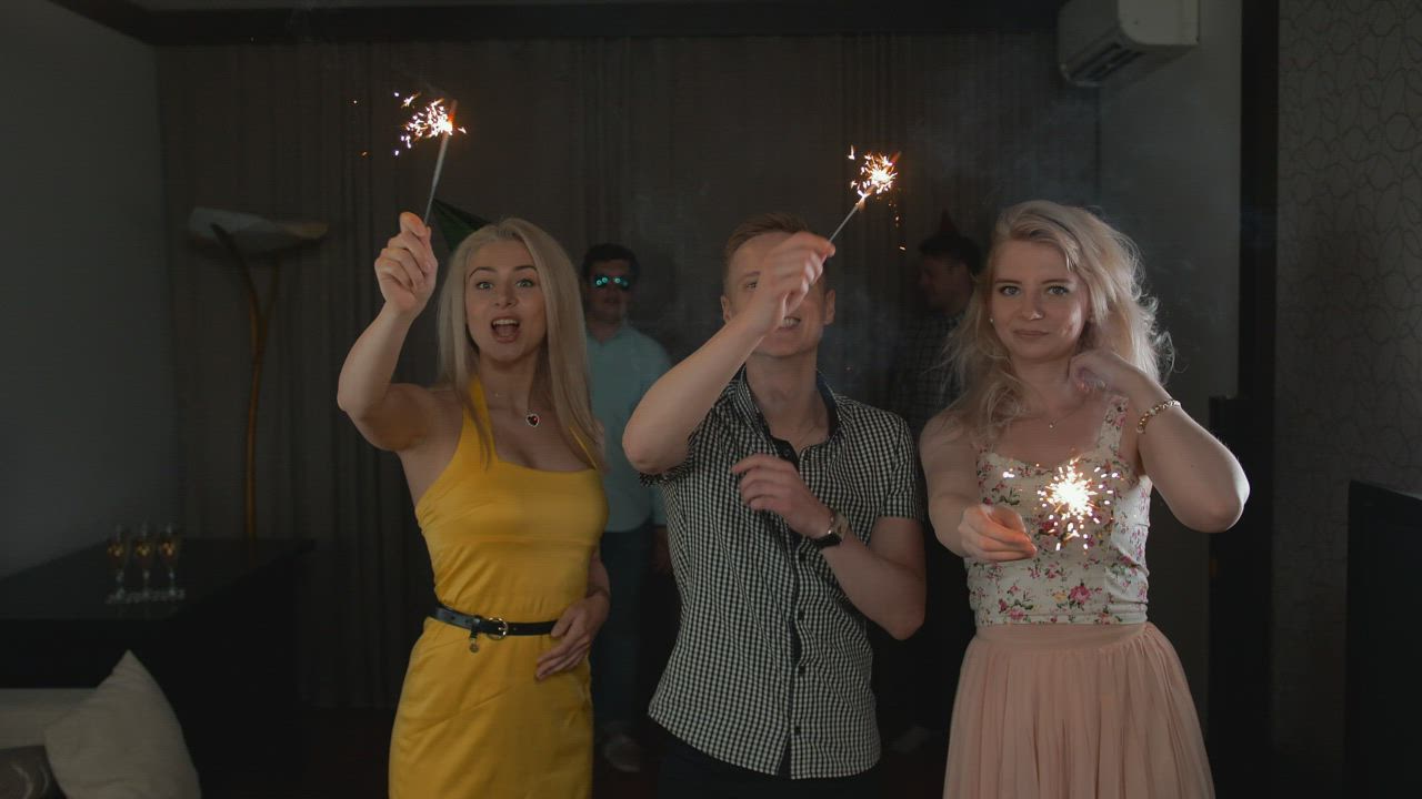 Young people partying with sparklers - Free Stock Video