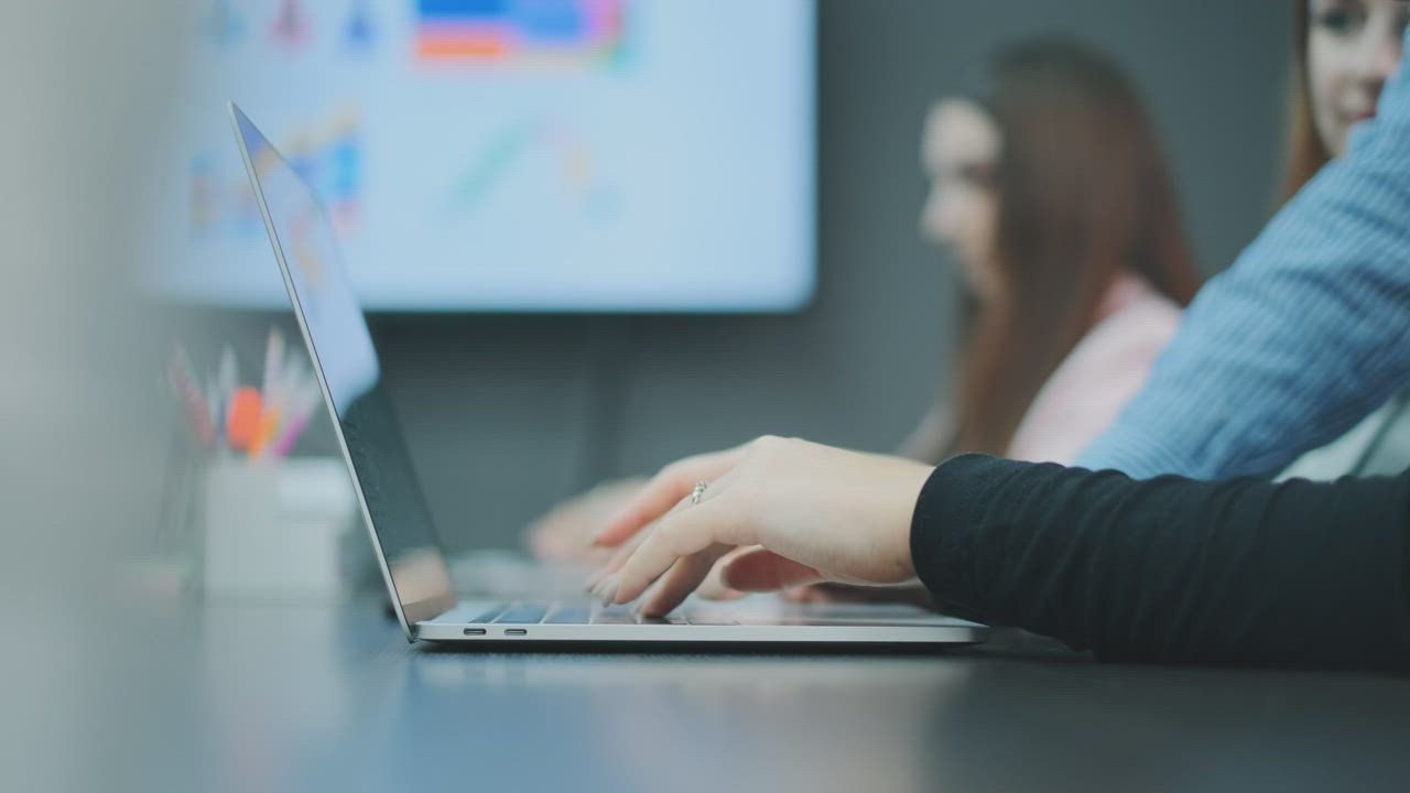 Woman's hands typing in a laptop keyboard - Free Stock Video