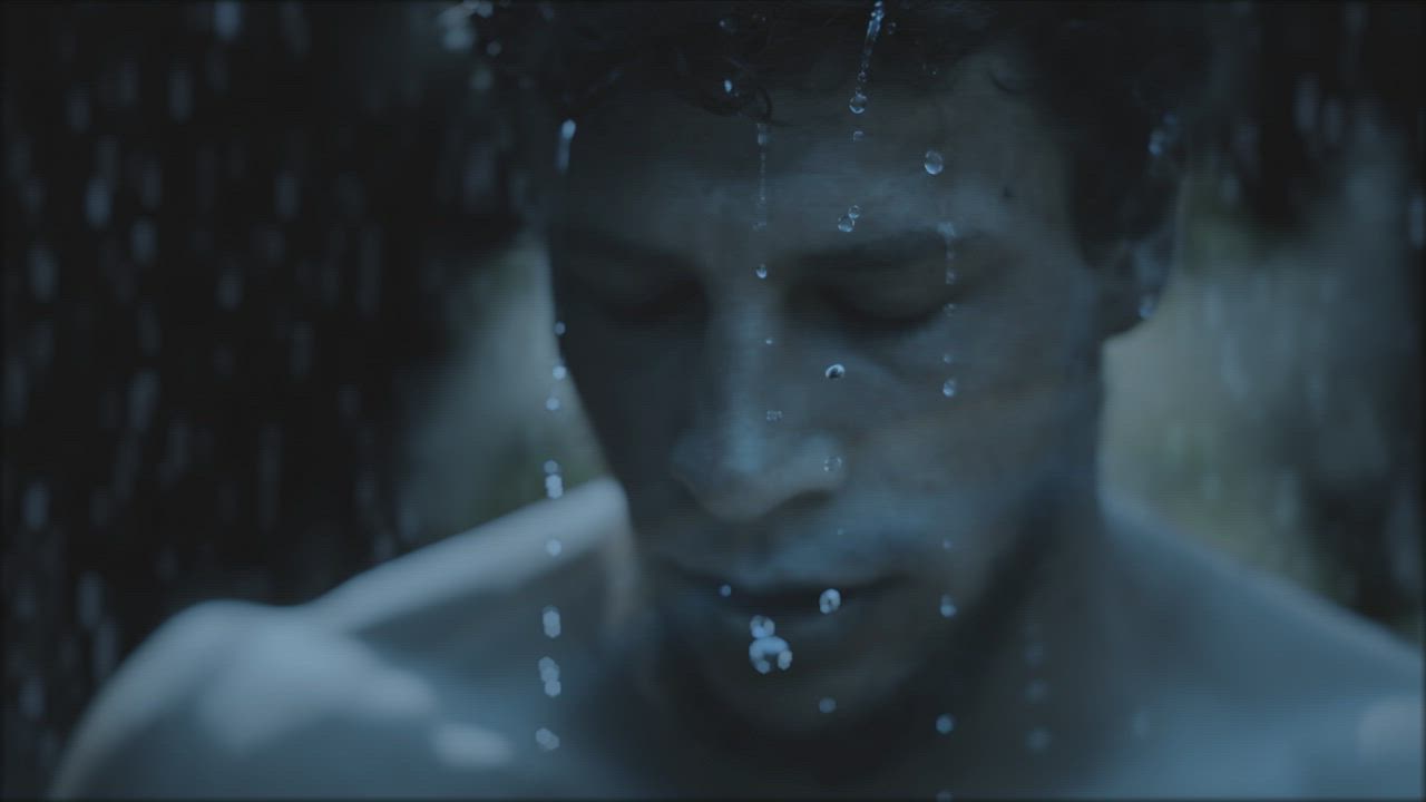 Standing man under a cold rain - Free Stock Video