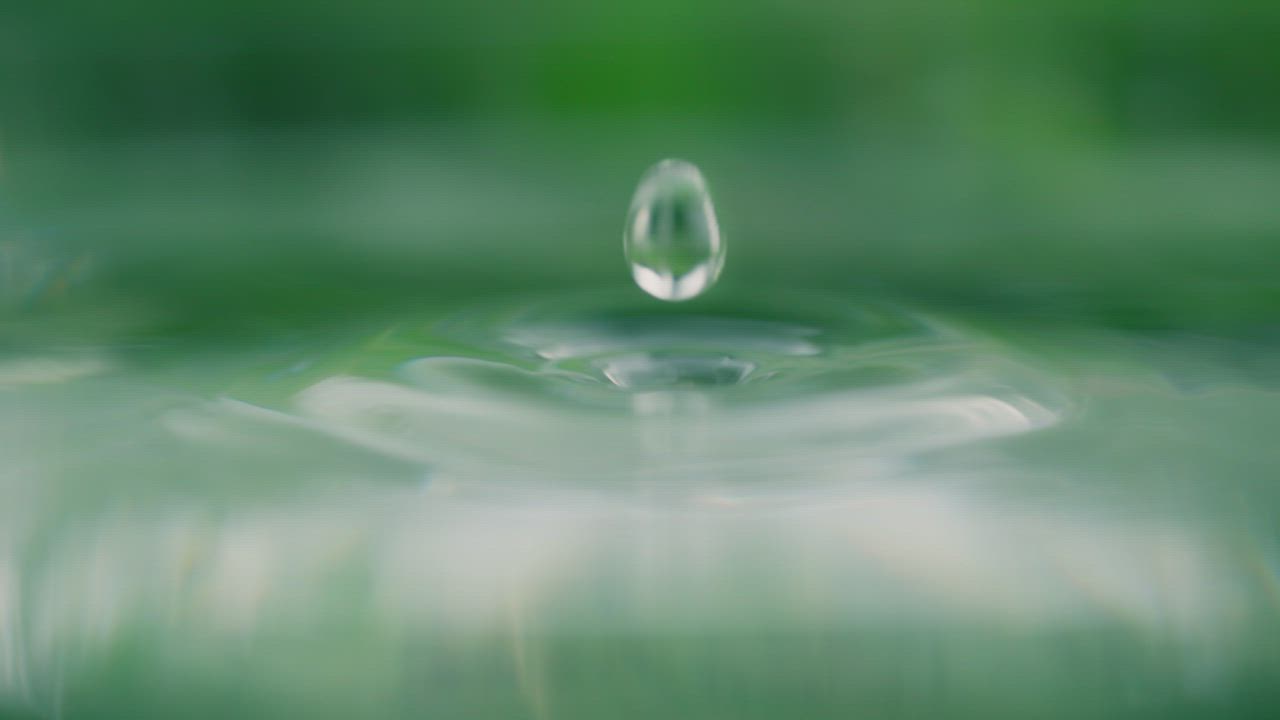 Water drop fall into a pot in slow motion - Free Stock Video