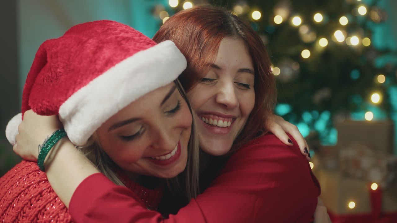 Two friends share time together at Christmas - Free Stock Video