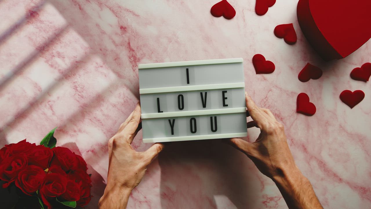 hands placing an I love you signboard with flowers and hearts - Free ...