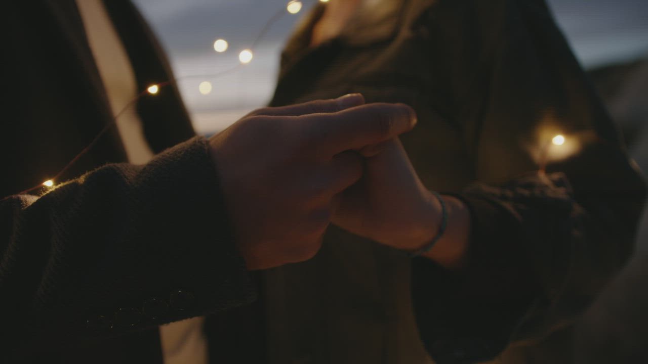 Couple caresses each other's hands with love - Free Stock Video