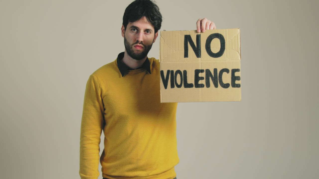 Man with a No Violence sign - Free Stock Video