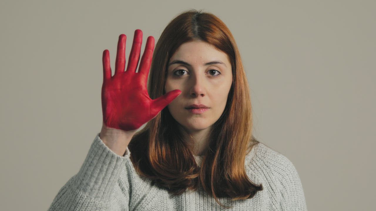 Sad girl raises her red painted right hand to stop the violence - Free ...