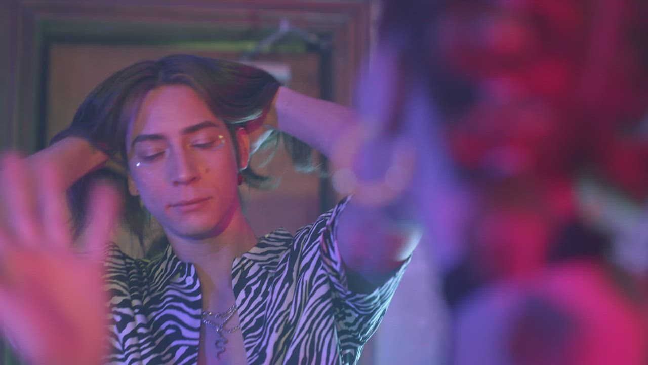 Stylish girl at a party sitting on a sofa - Free Stock Video