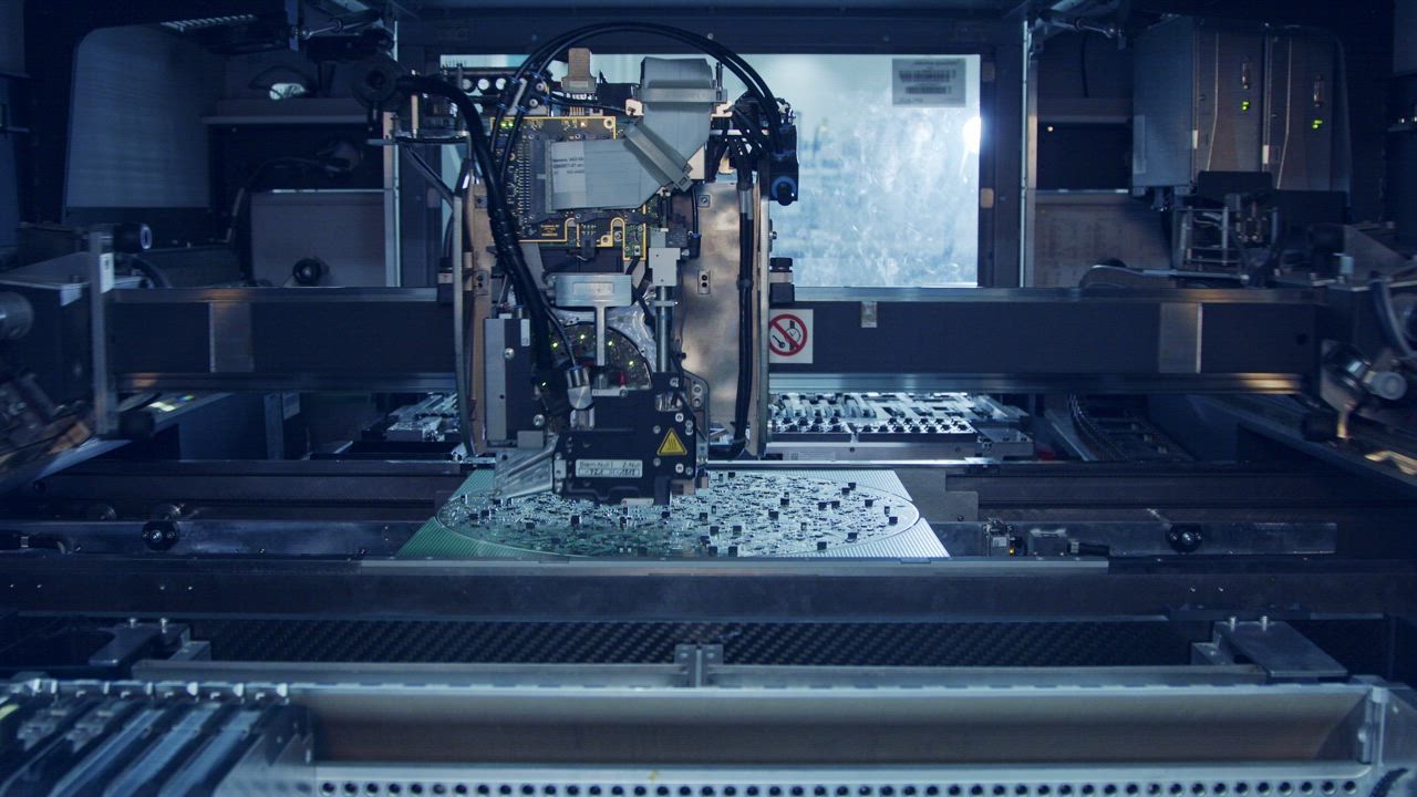Machine placing components on a circuit board - Free Stock Video