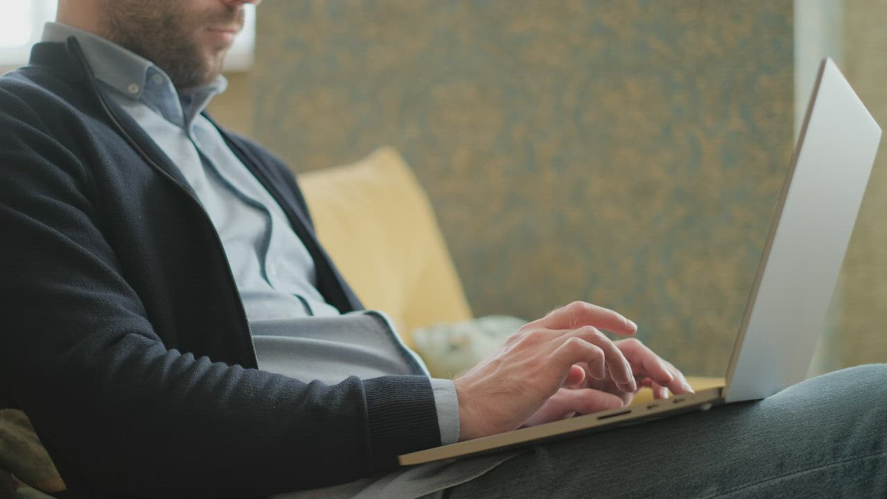 Man sending emails on a laptop - Free Stock Video