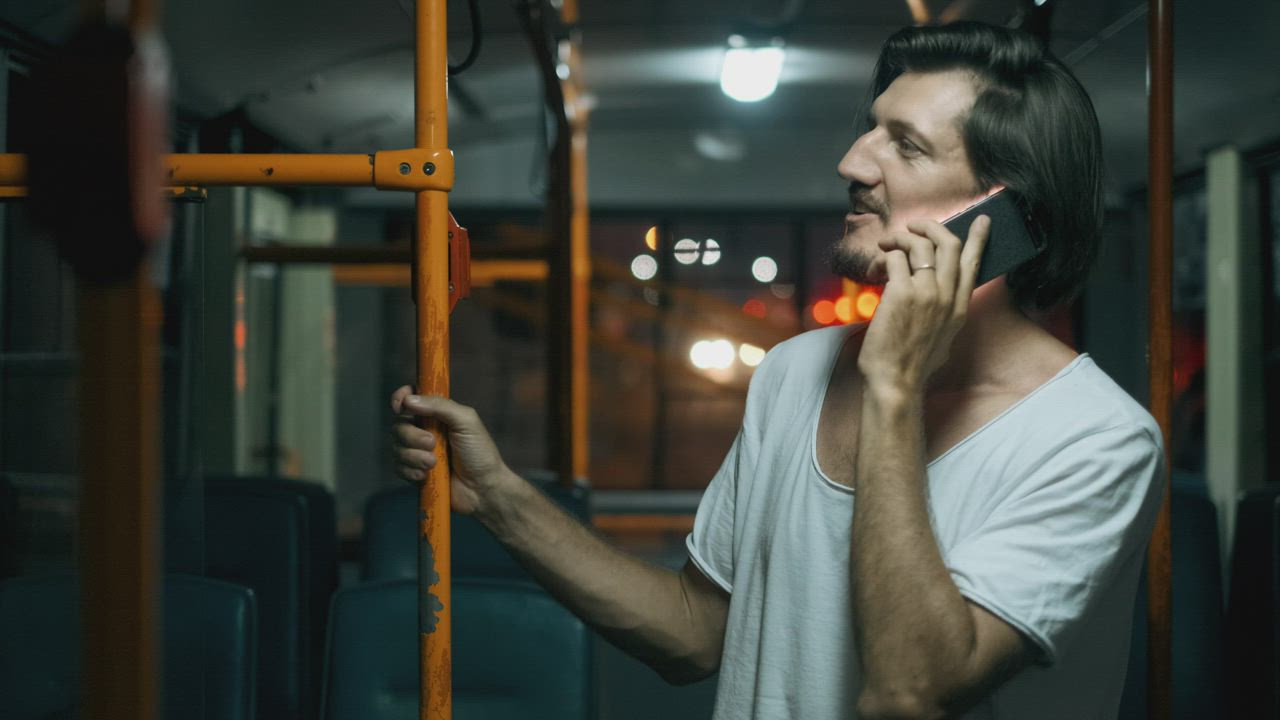 Hilarious man talking with a smartphone - Free Stock Video