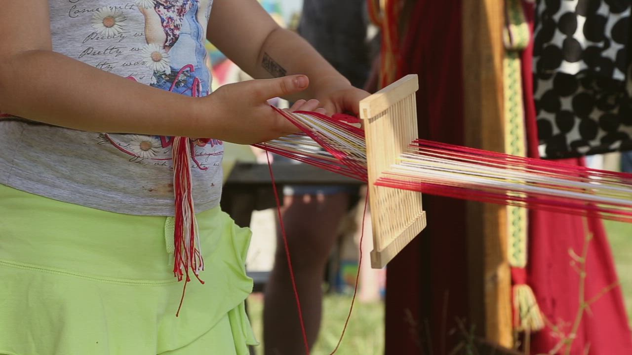 Needle work on a spinning belt - Free Stock Video