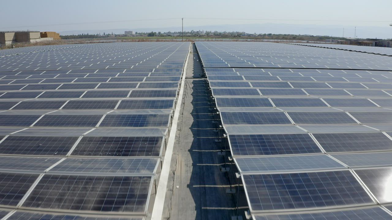 View of a solar panel farm generating sustainable energy - Free Stock Video