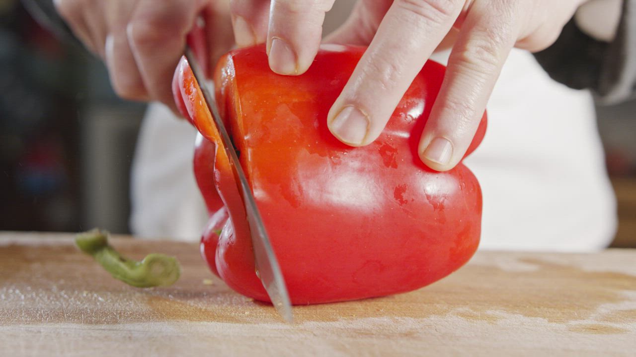 Chef slicing a red bell pepper on a wooden chopping board - Free Stock ...