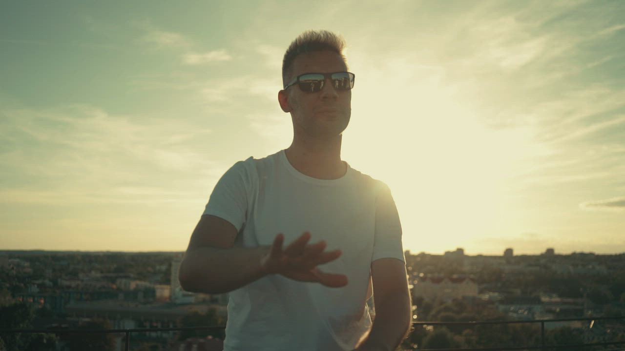 Guy dancing breakbeat on a rooftop - Free Stock Video