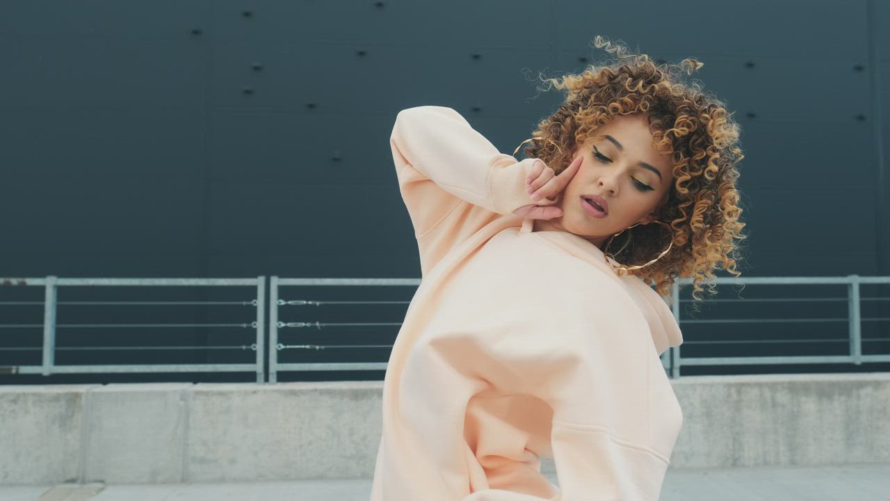 Curly head girl dancing outside - Free Stock Video