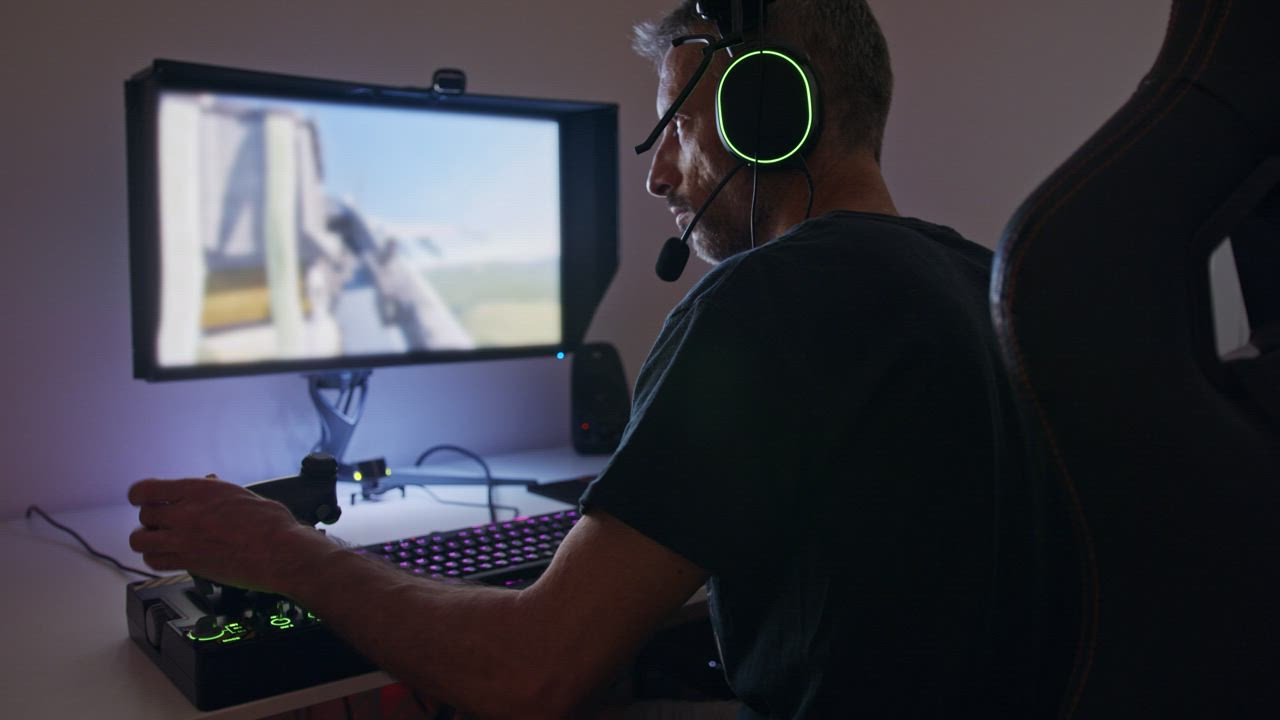 Man sitting in a gaming chair while playing video games - Free Stock Video