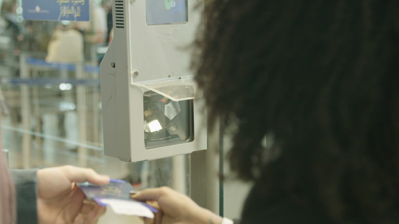 Security agent checking passports at boarding gate - Free Stock Video