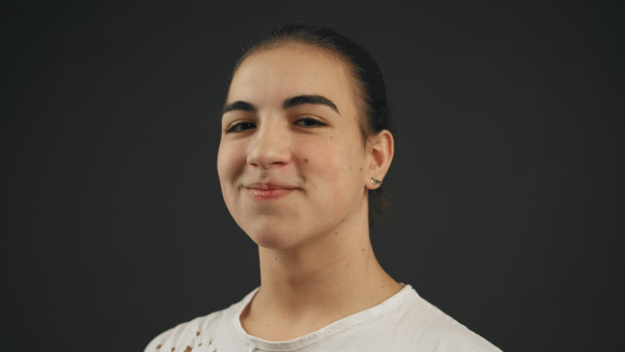 Portrait of a young and smiley teenager - Free Stock Video