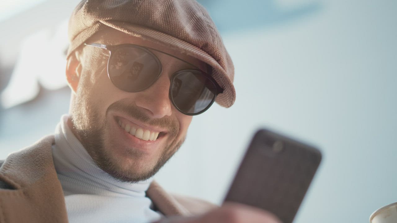 Young man texting with a smartphone - Free Stock Video