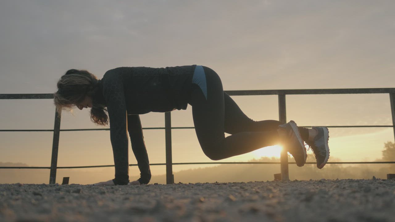 Fitness woman doing intense exercise outdoors - Free Stock Video