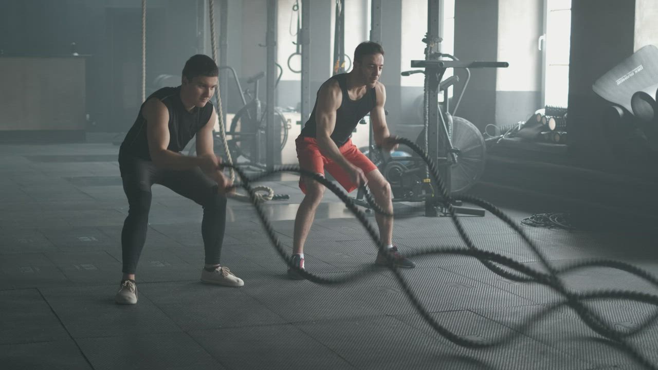 Athletes training hard in the gym - Free Stock Video