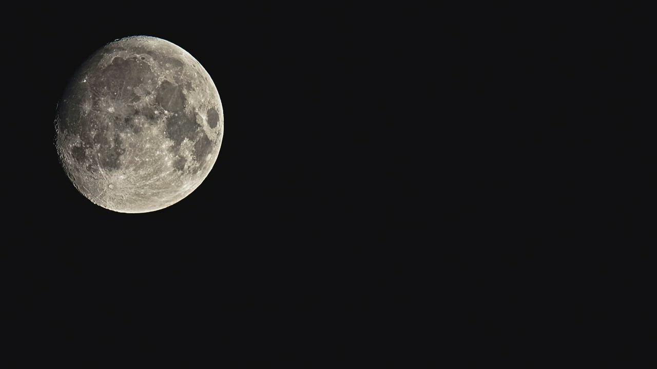 Close up of a bright, full moon at night - Free Stock Video
