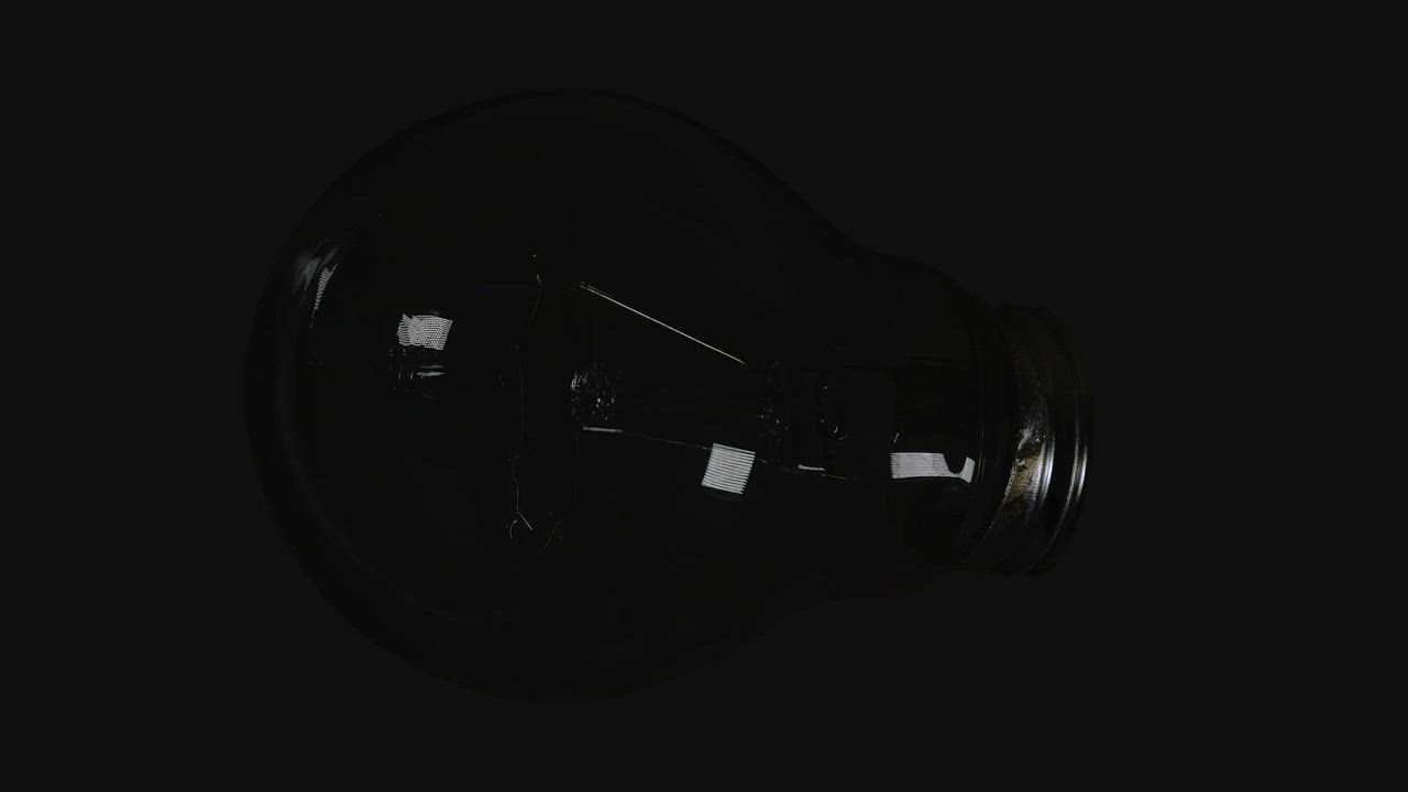Close up of a light bulb being switched on - Free Stock Video