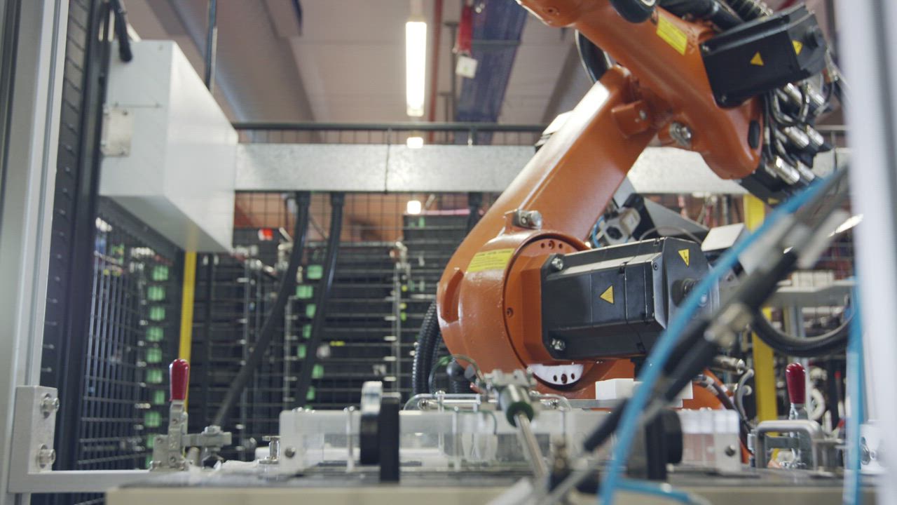 Robot working in an electronics manufacturing facility - Free Stock Video