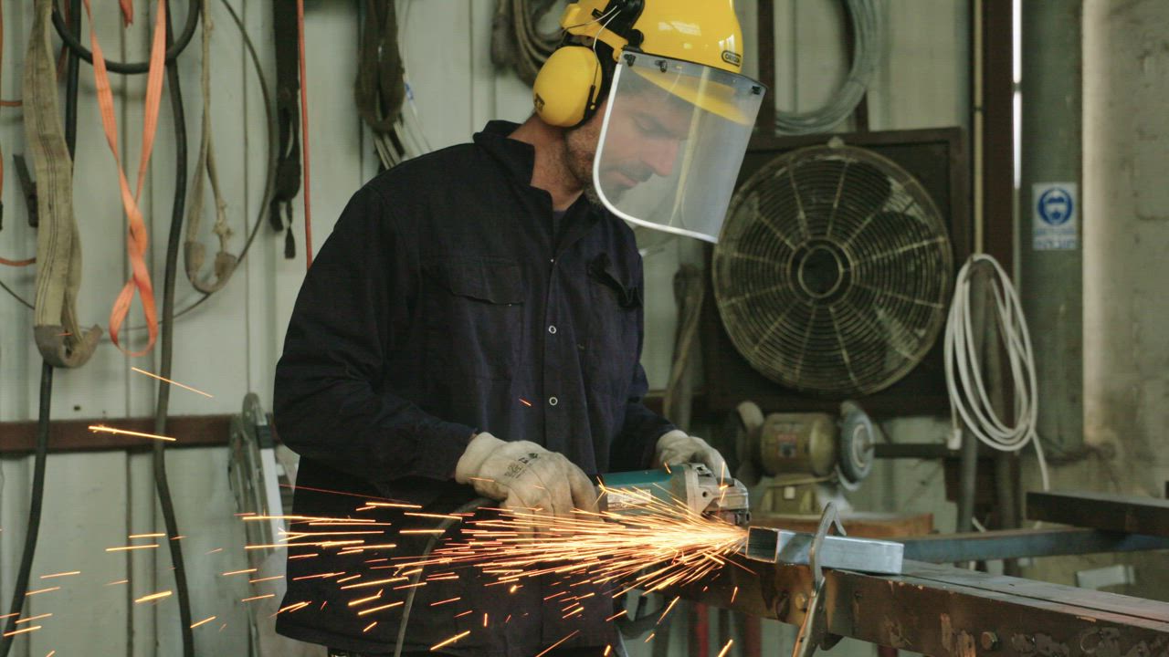 Worker using a metal welder - Free Stock Video