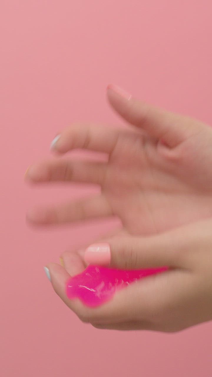 Woman playing with Pink slime with her hands - Free Stock Video