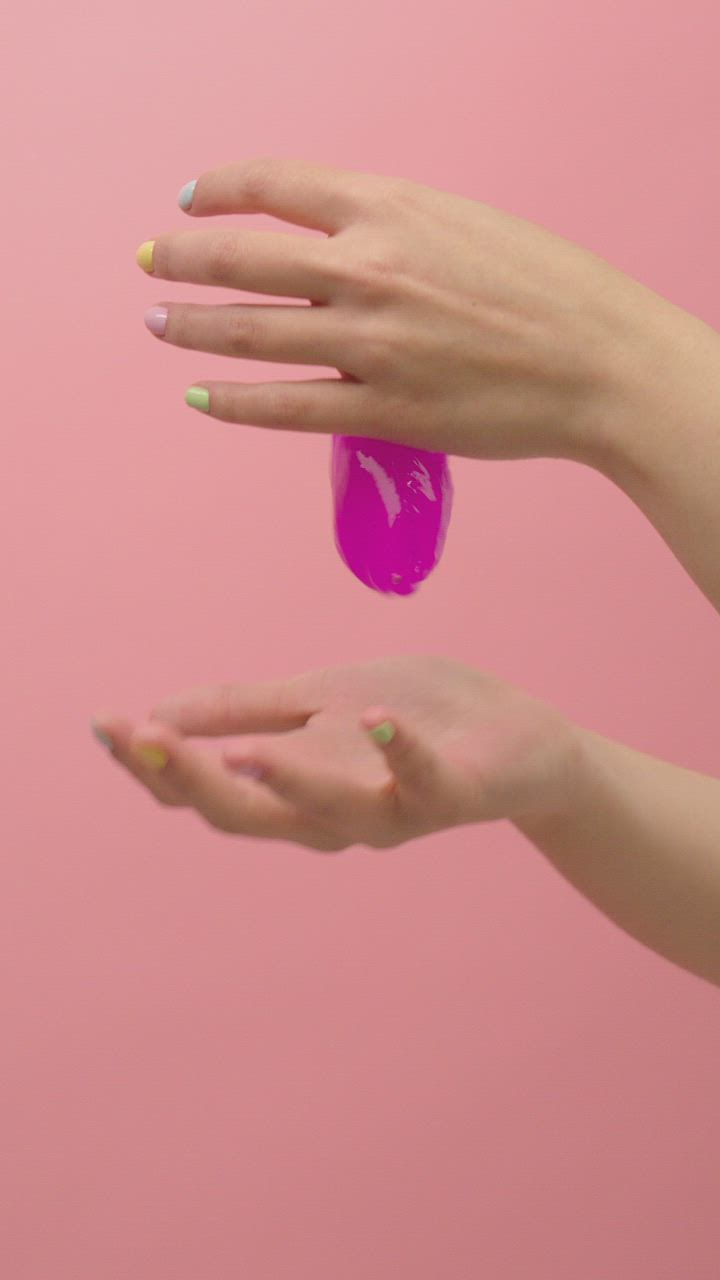 Hands of a woman playing with pink slime - Free Stock Video