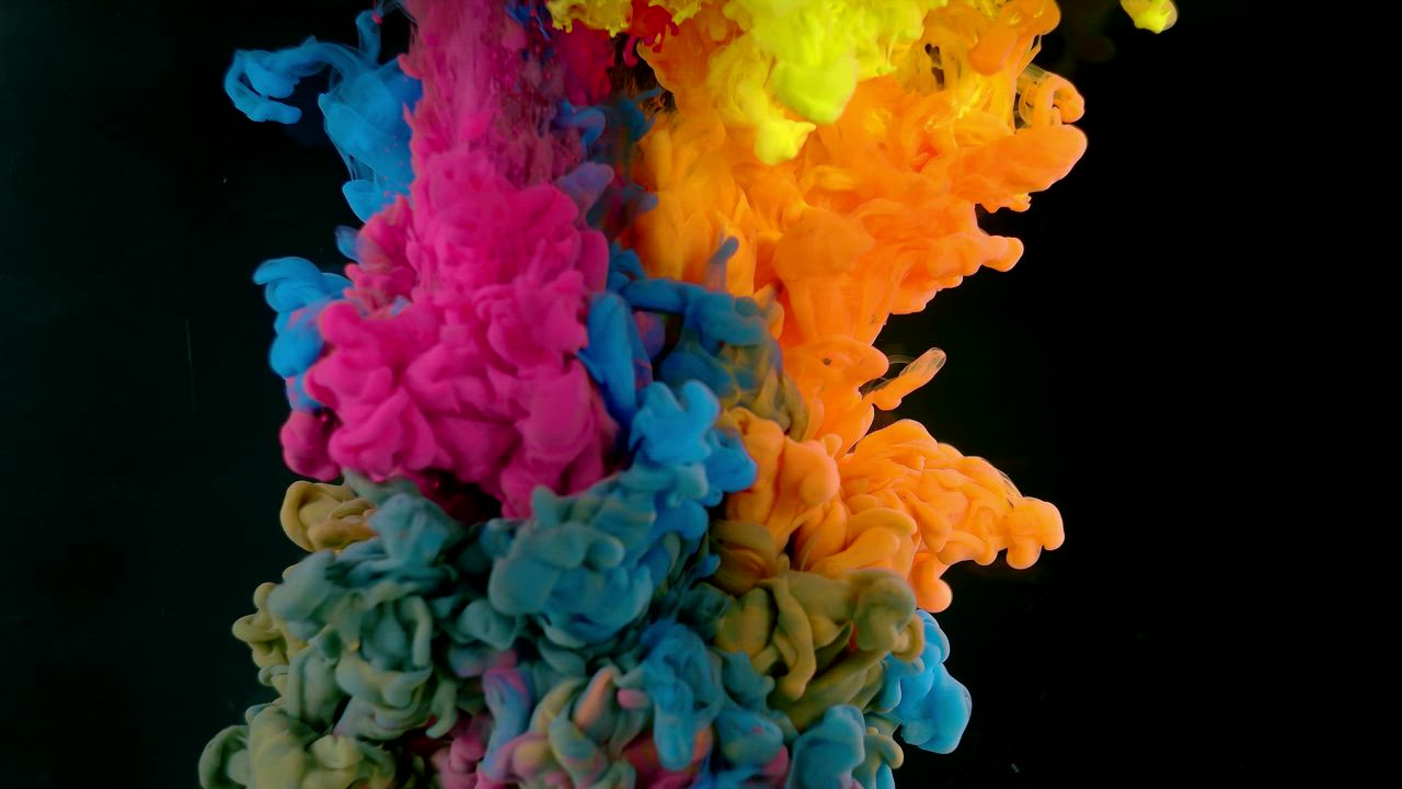 Blast of neon colors on water - Free Stock Video