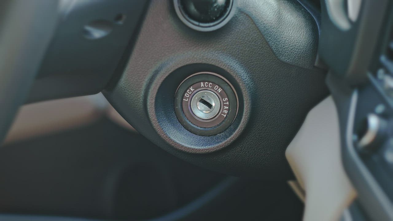 Close up of a man starting a car with keys - Free Stock Video