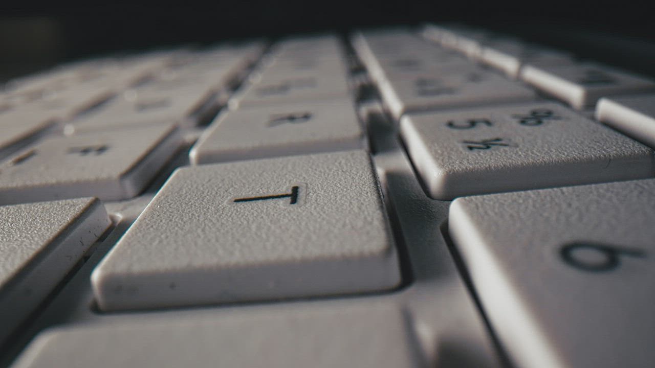 Macro view of keyboard keys on a laptop - Free Stock Video