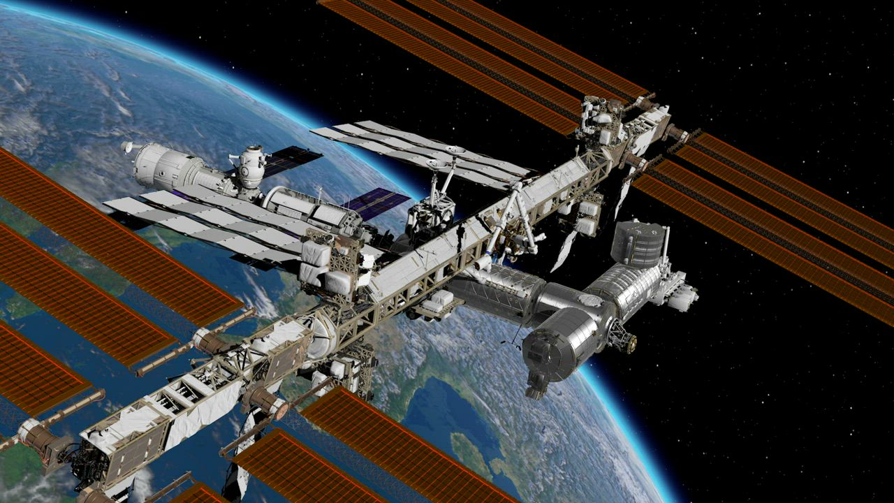 Rotating International Space Station (ISS) floating above Earth - Free ...
