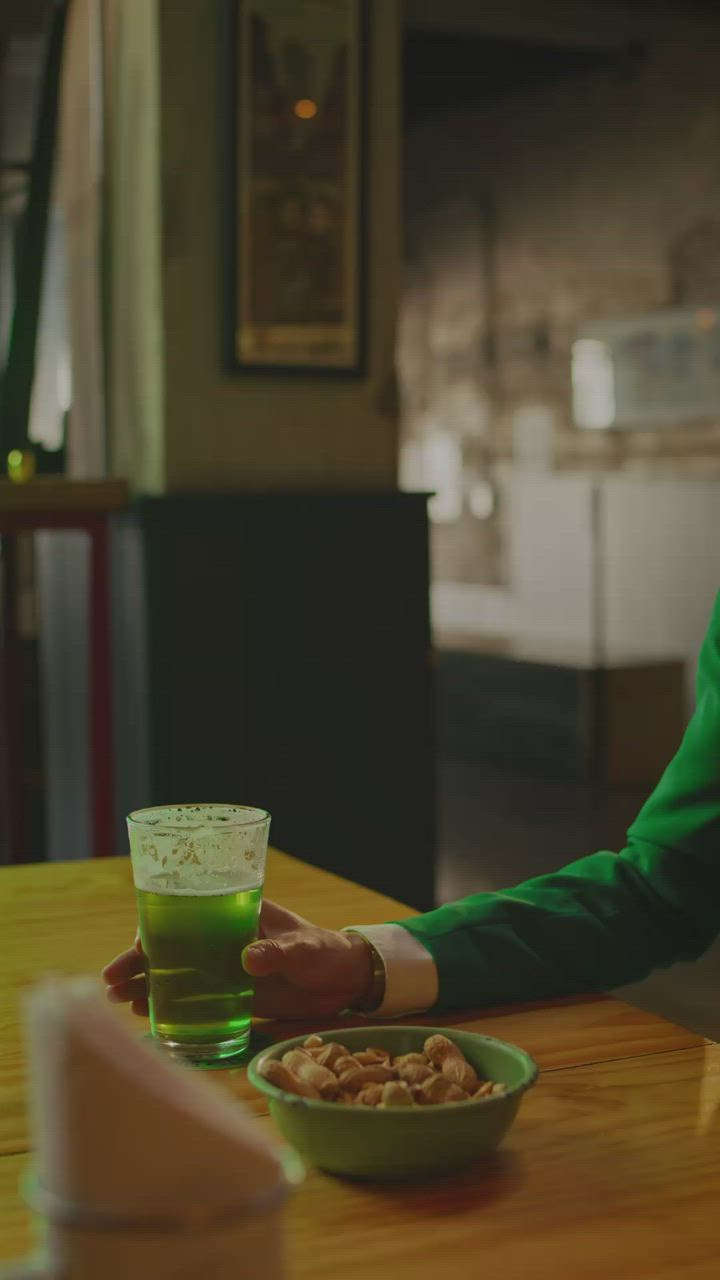 Sophisticated Gentleman Celebrating Saint Patrick's Day at a Bar - Free ...