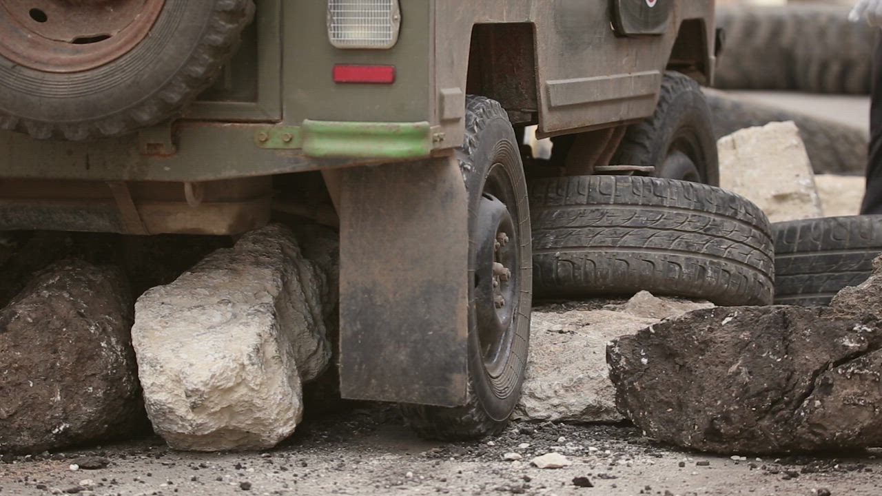 Off road truck driving over rock obstacles - Free Stock Video